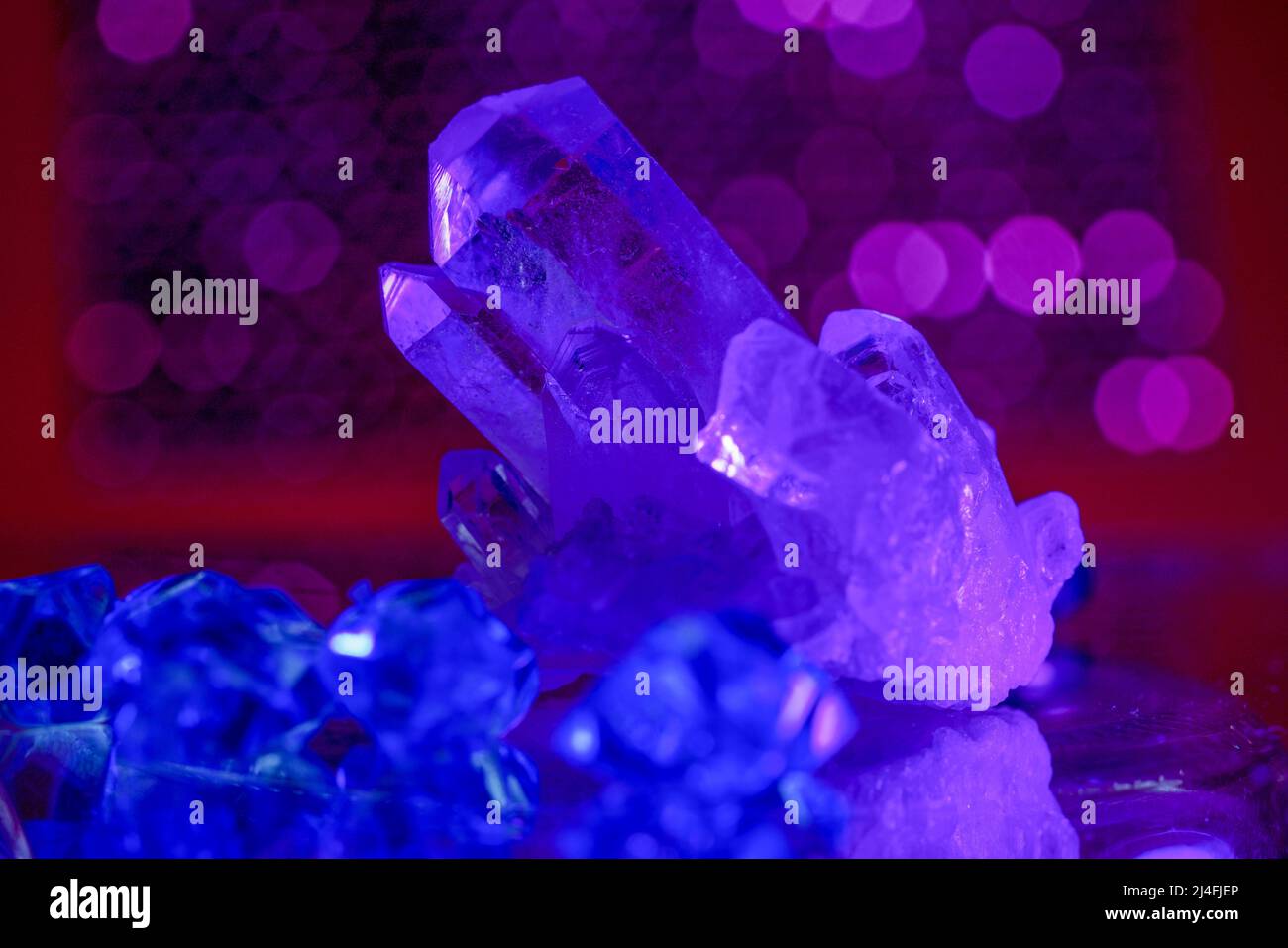 Quartz with mineral inclusions in the studio in front of a background ...
