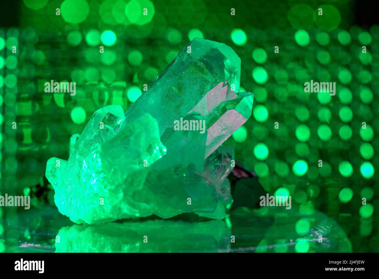 Quartz with mineral inclusions in the studio in front of a background ...
