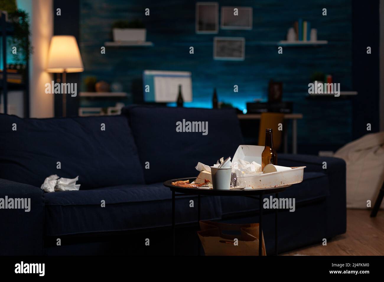 Empty living room space with leftovers stinky rubbish on table, dirty ...