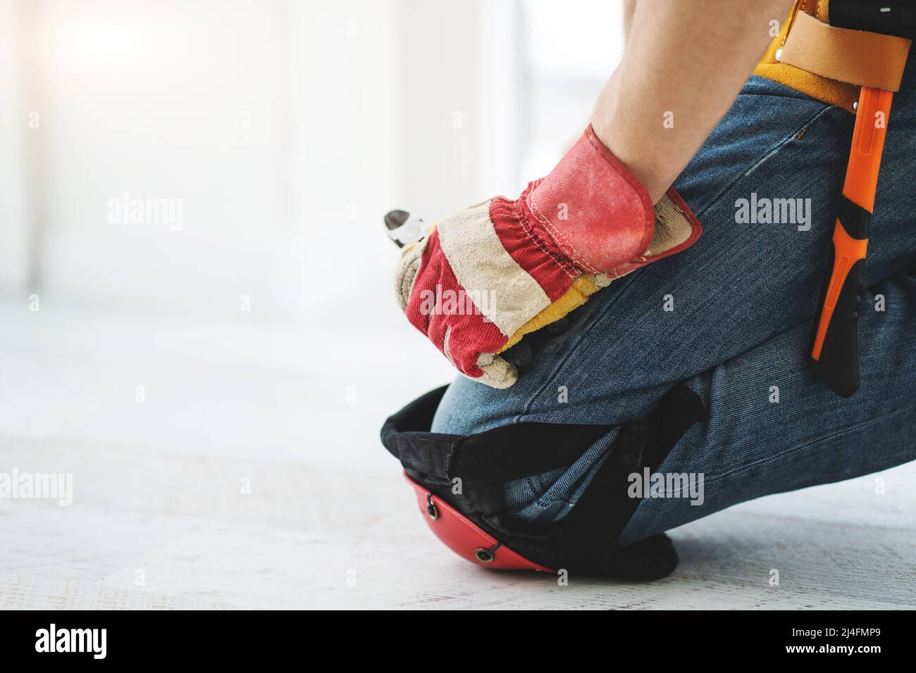 Installation foreman performing repair on floor Stock Photo - Alamy