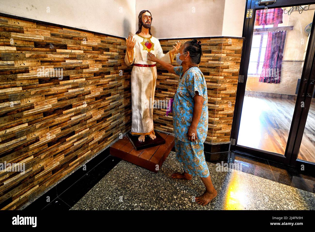 A Christian devotee seen offering prayers during Good Friday at Prabhu ...