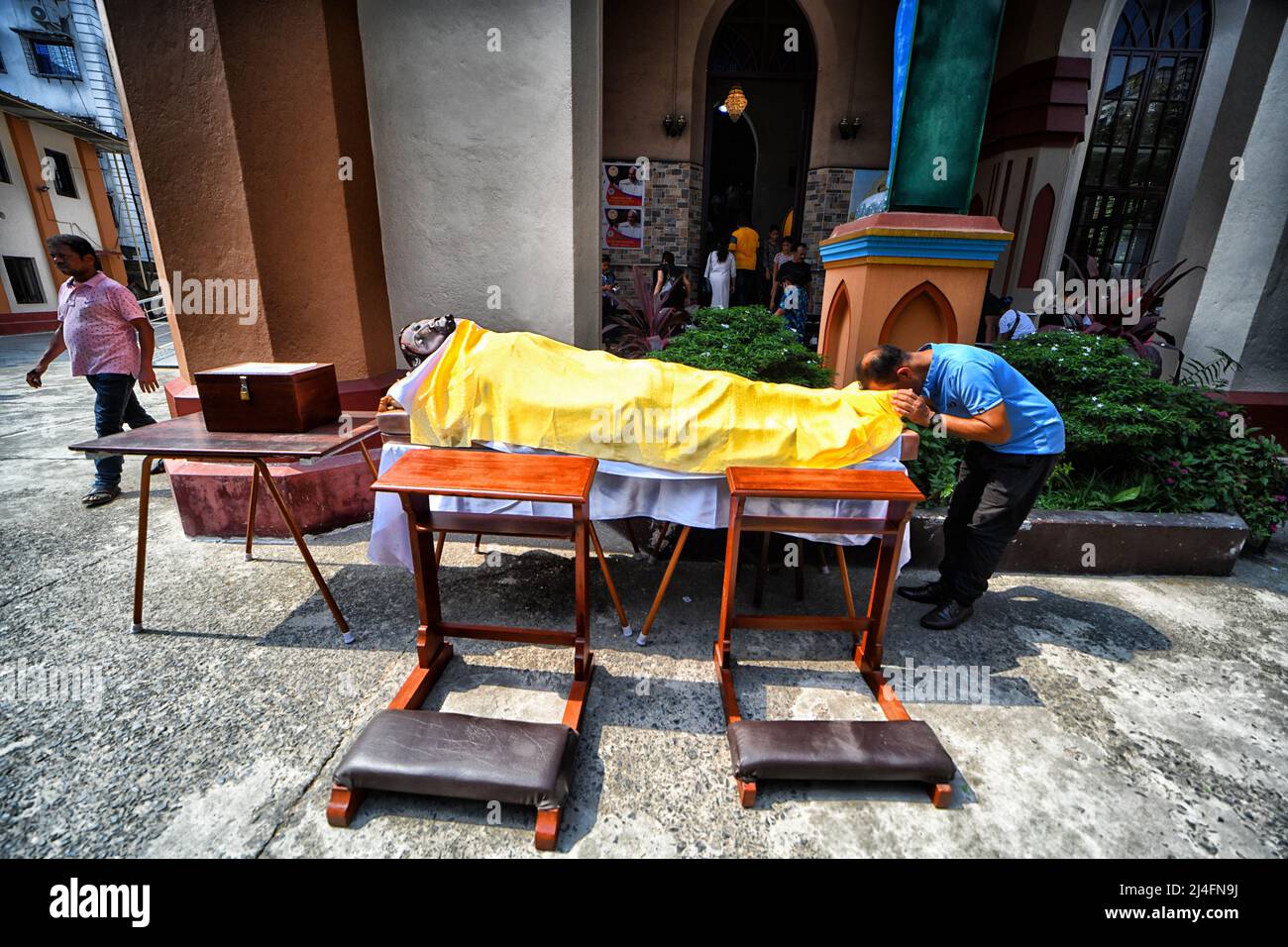 A Christian devotee seen offering prayers during Good Friday at Prabhu ...