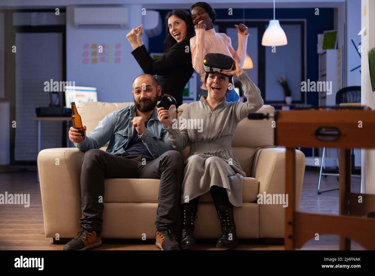 Happy woman celebrating video games win on console, playing on tv with ...