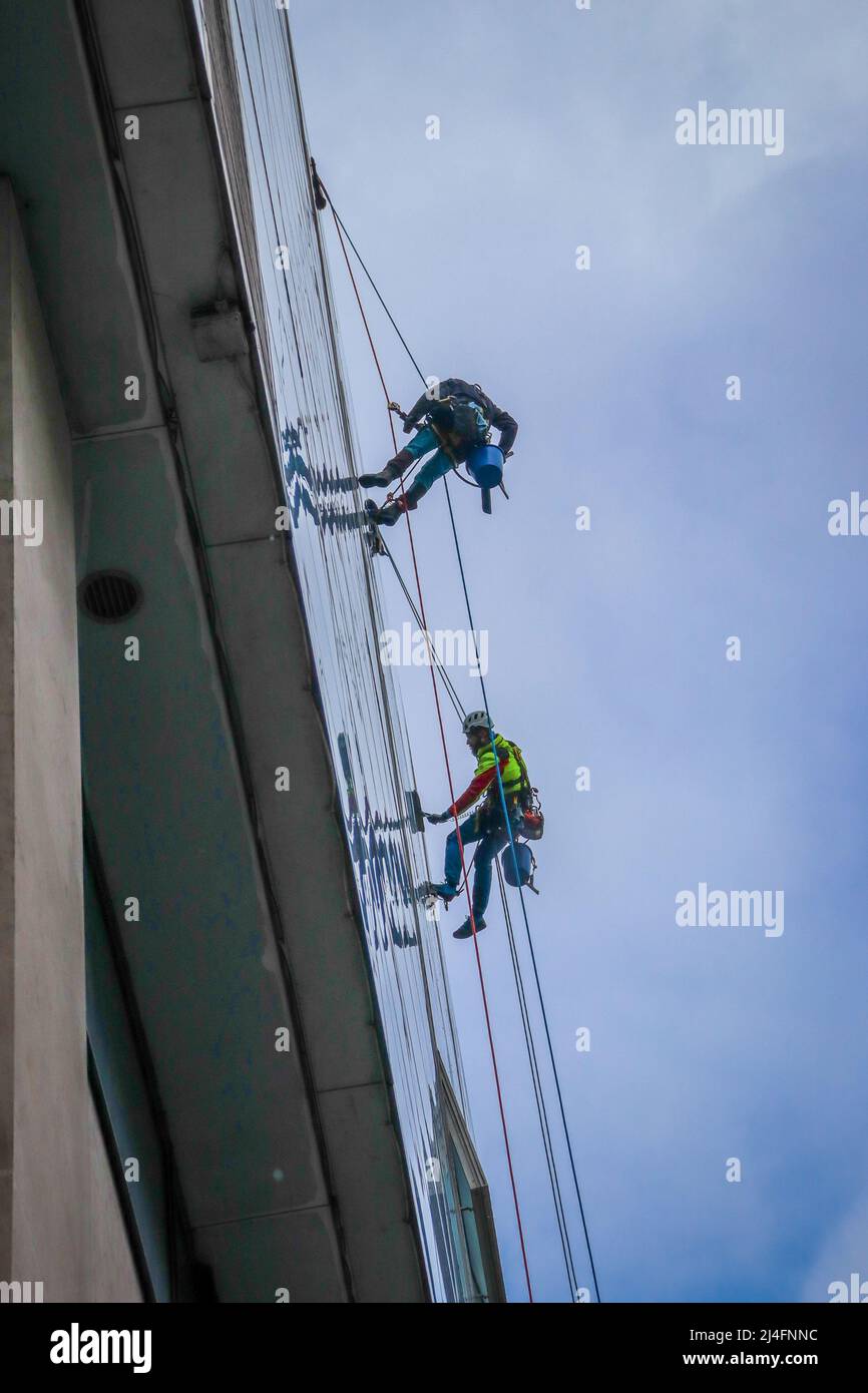 Two People Abseiling to clean windows, Liverpool City Centre Stock ...