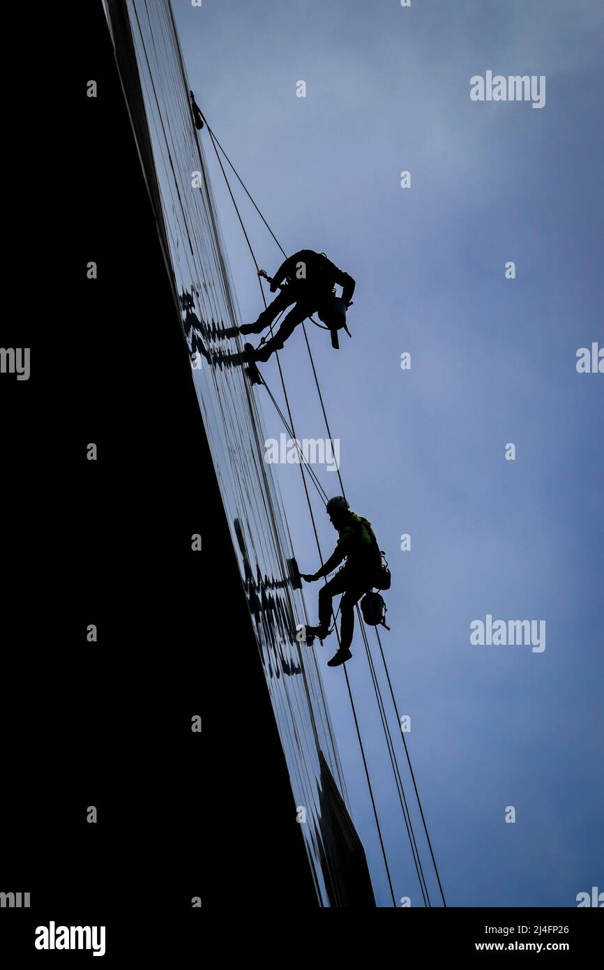 Two People Abseiling to clean windows, Liverpool City Centre Stock ...