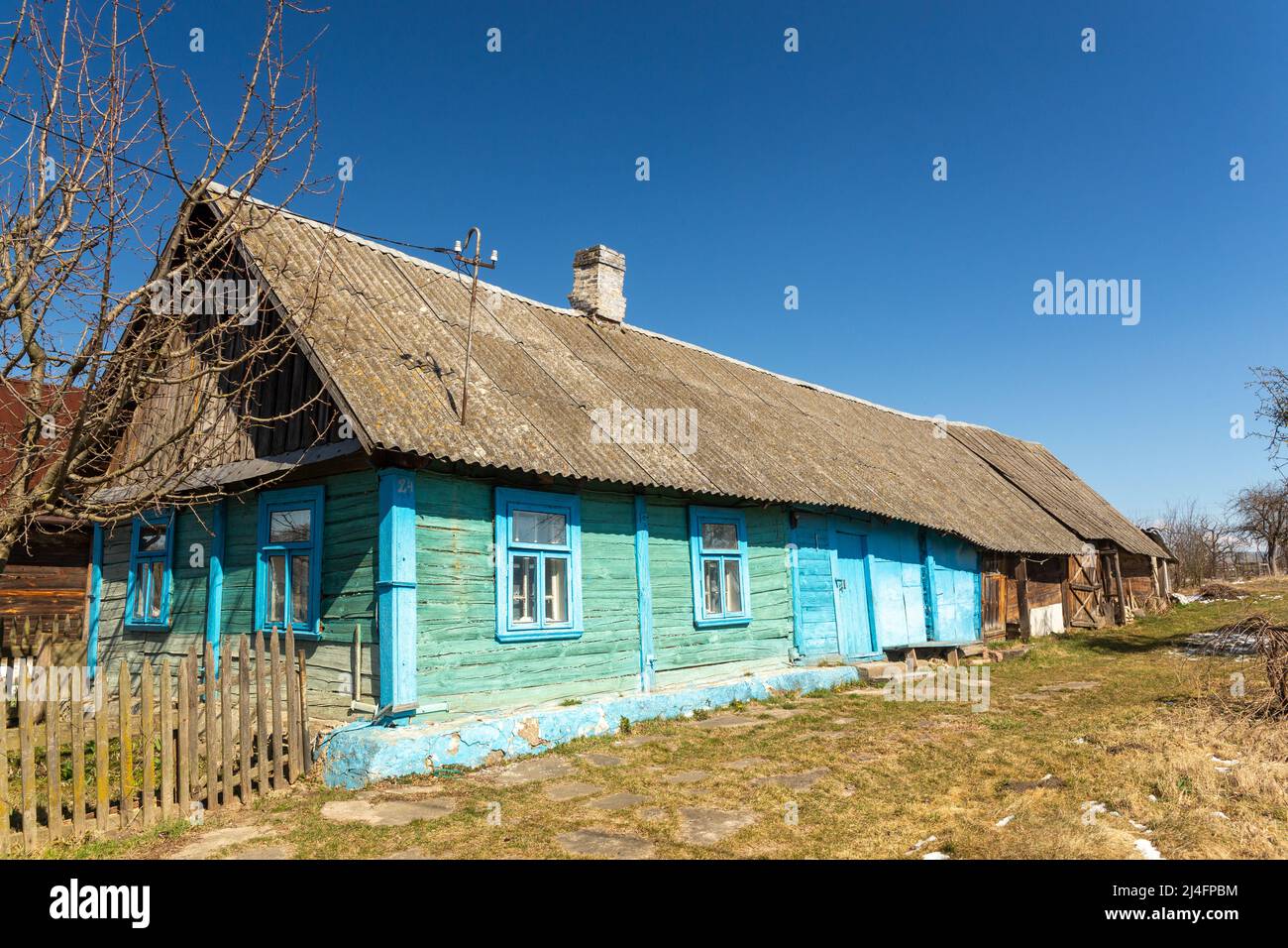 Old wooden blue house in village. Farmhouse in Belarus. View of rustic ...