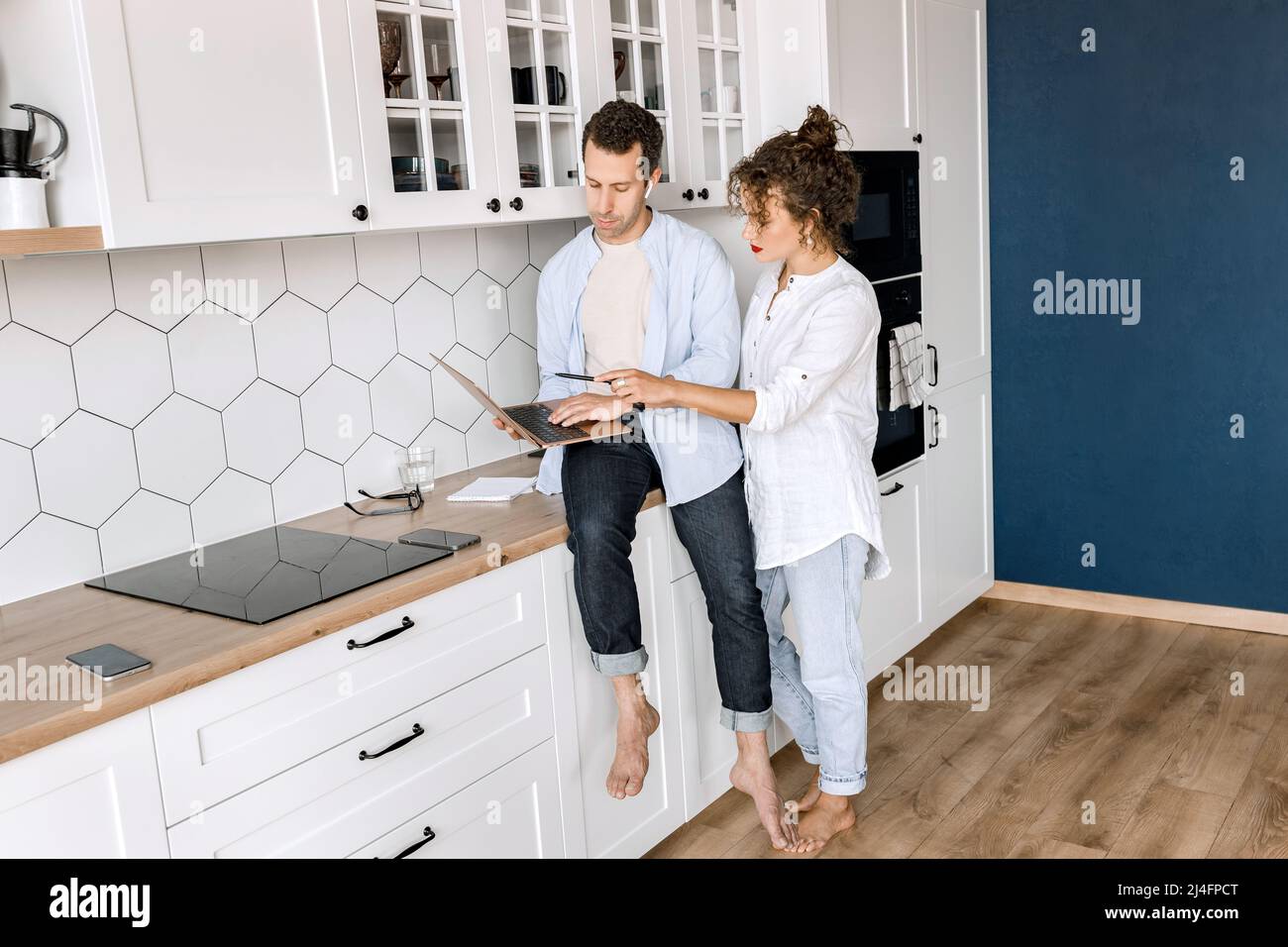 Successful stylish business partners working on project in modern ...