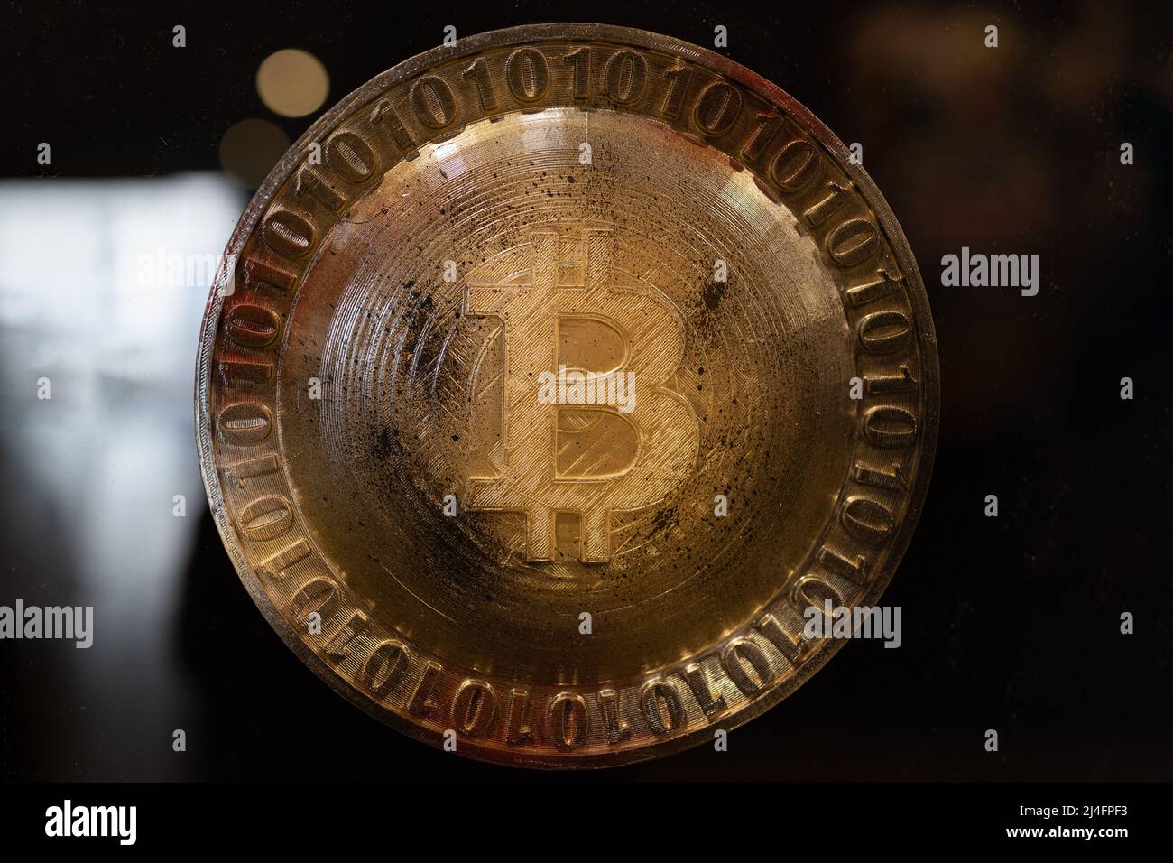 Bitcoin Symbol on a Round Golden Emblem Surrounded by Zeroes and Ones ...
