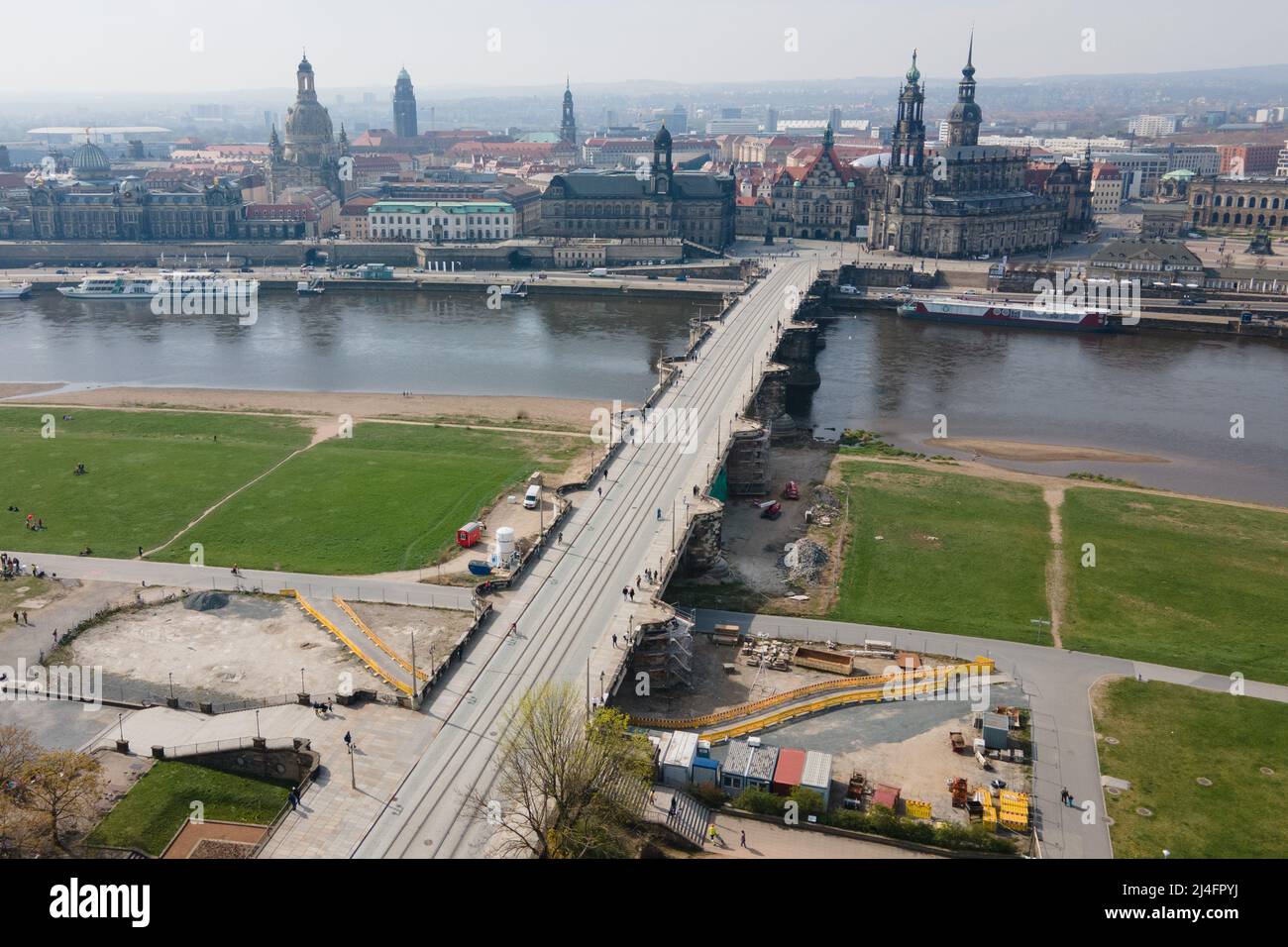 Dresden, Germany. 14th Apr, 2022. Passers-by walk across the Augustus ...