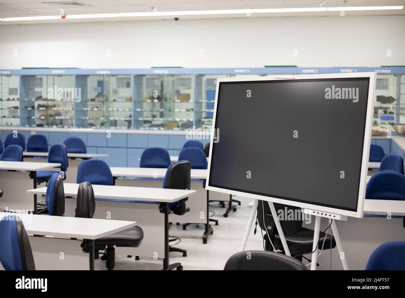 casual class or meeting room with modern Digital blackboard with chairs ...
