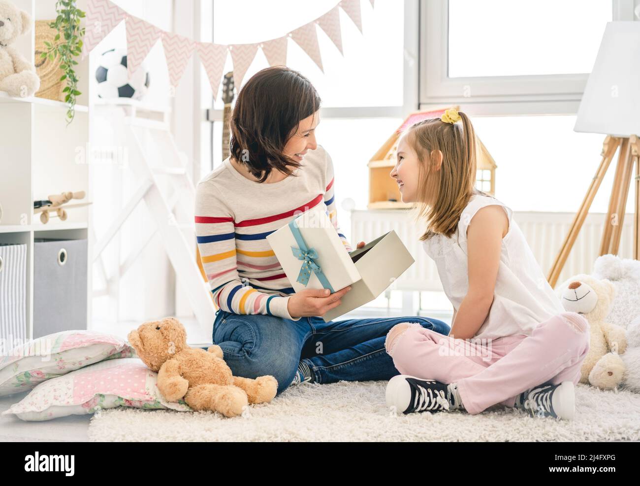 Pretty woman opening box with present Stock Photo - Alamy