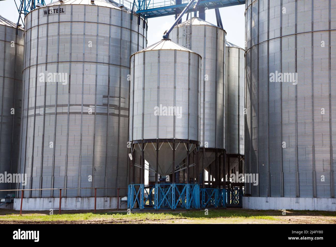 Closeup photo of modern steel grain elevator Stock Photo - Alamy