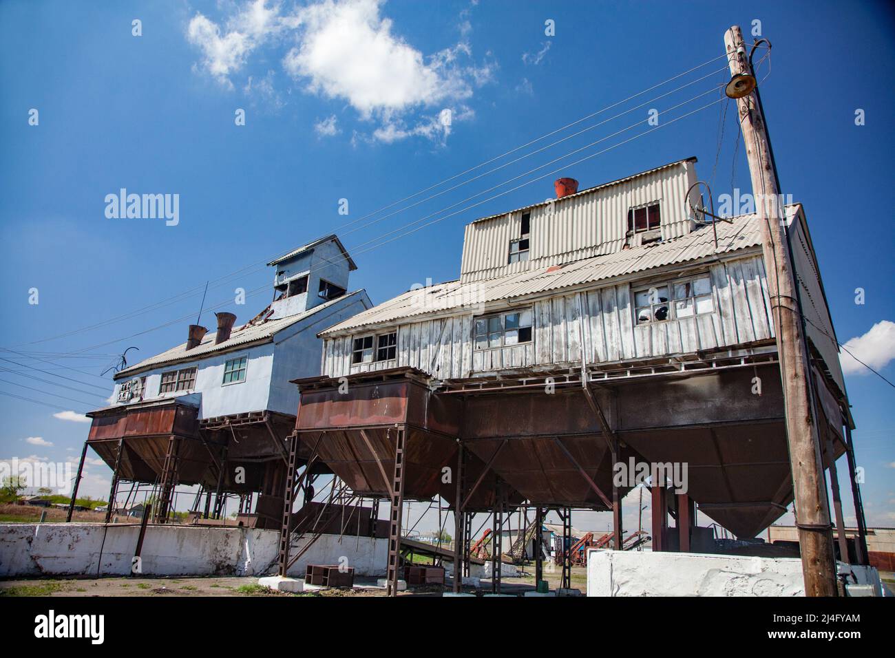 Old outdated Soviet grain storage. Cone hopper for truck loading ...