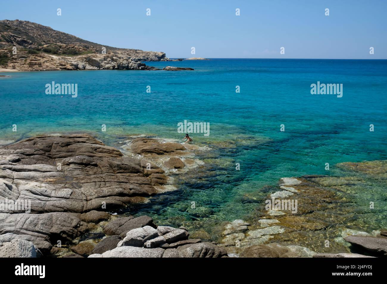 Ios, Greece - June 12, 2021 : A single woman climbing the the amazing ...