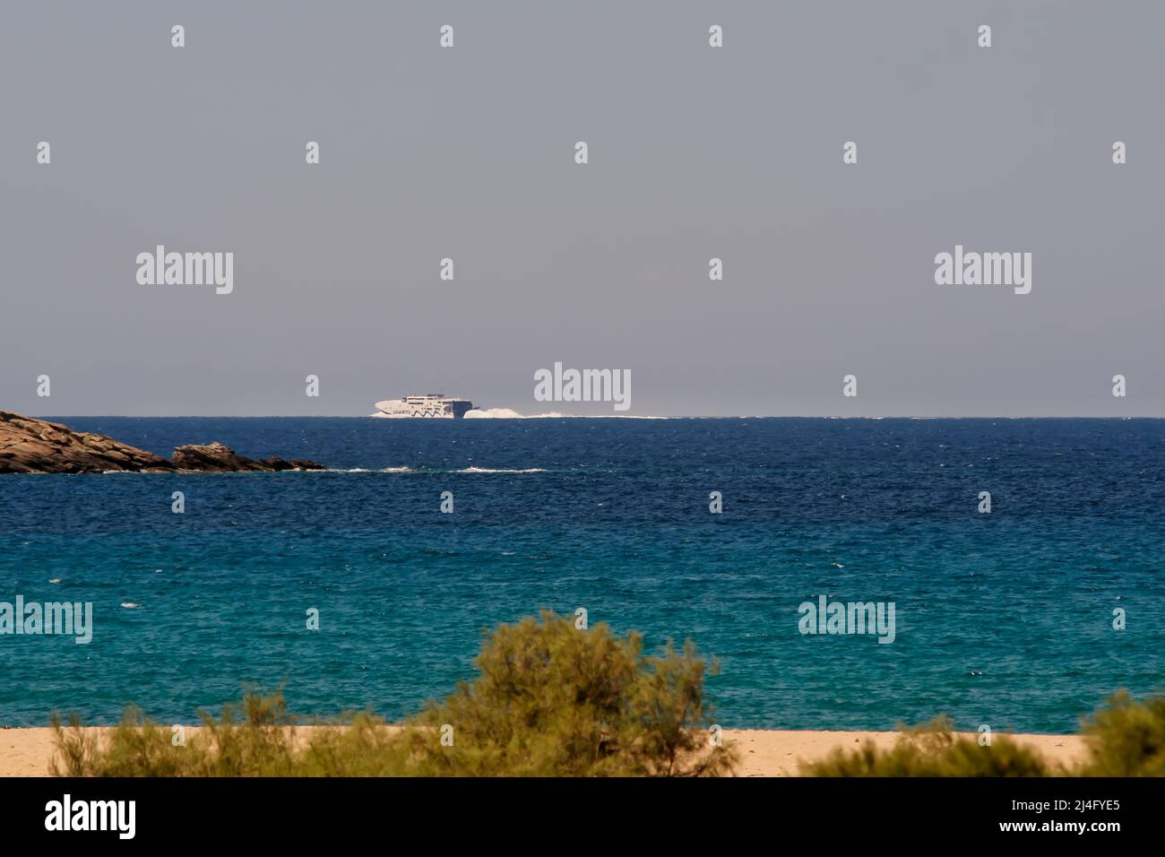 Ios, Greece - May 16, 2021 : A ferry boat passing in front of the ...