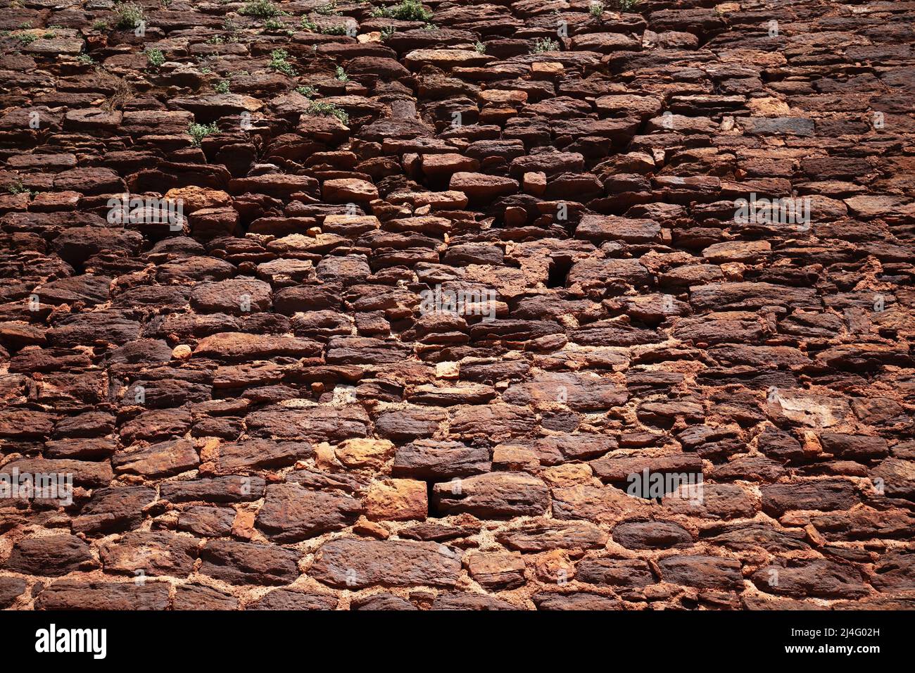 Texture of an old medieval red brick wall. Background of red brick ...