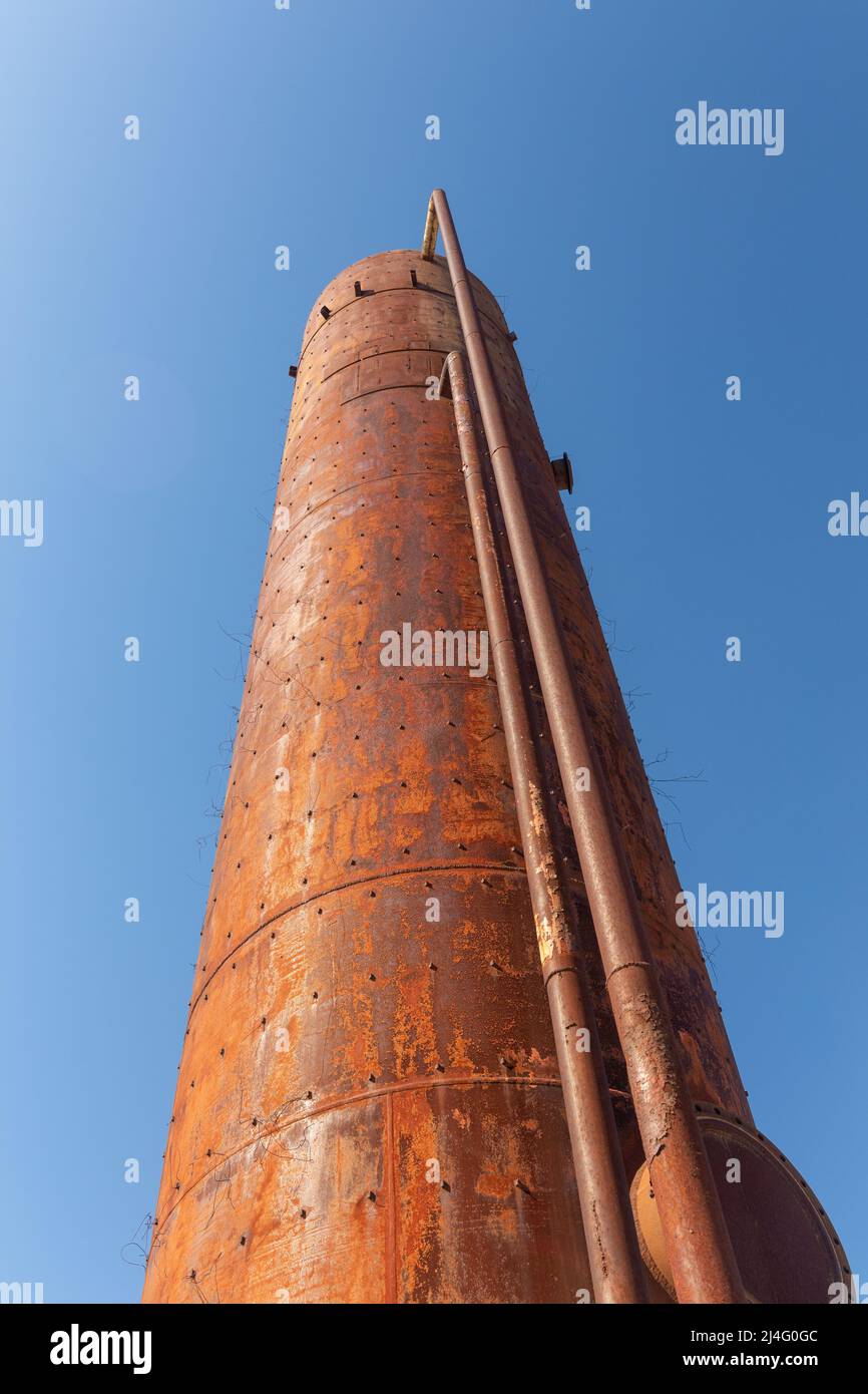 An old iron rusty water tower in a rural town. Rusty tower of rural ...