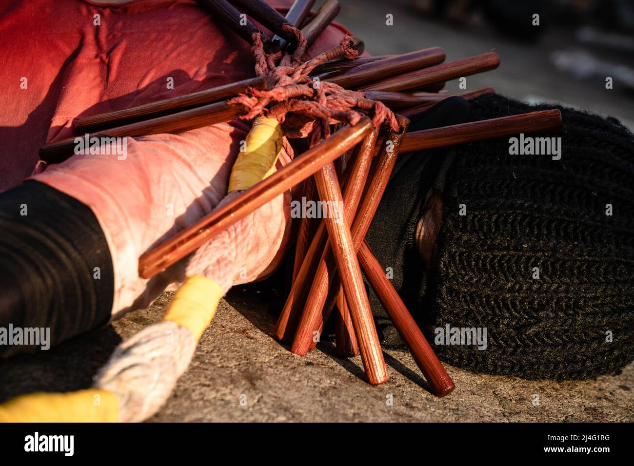 A flagellant with a bloody back lays on the ground during Good Friday ...
