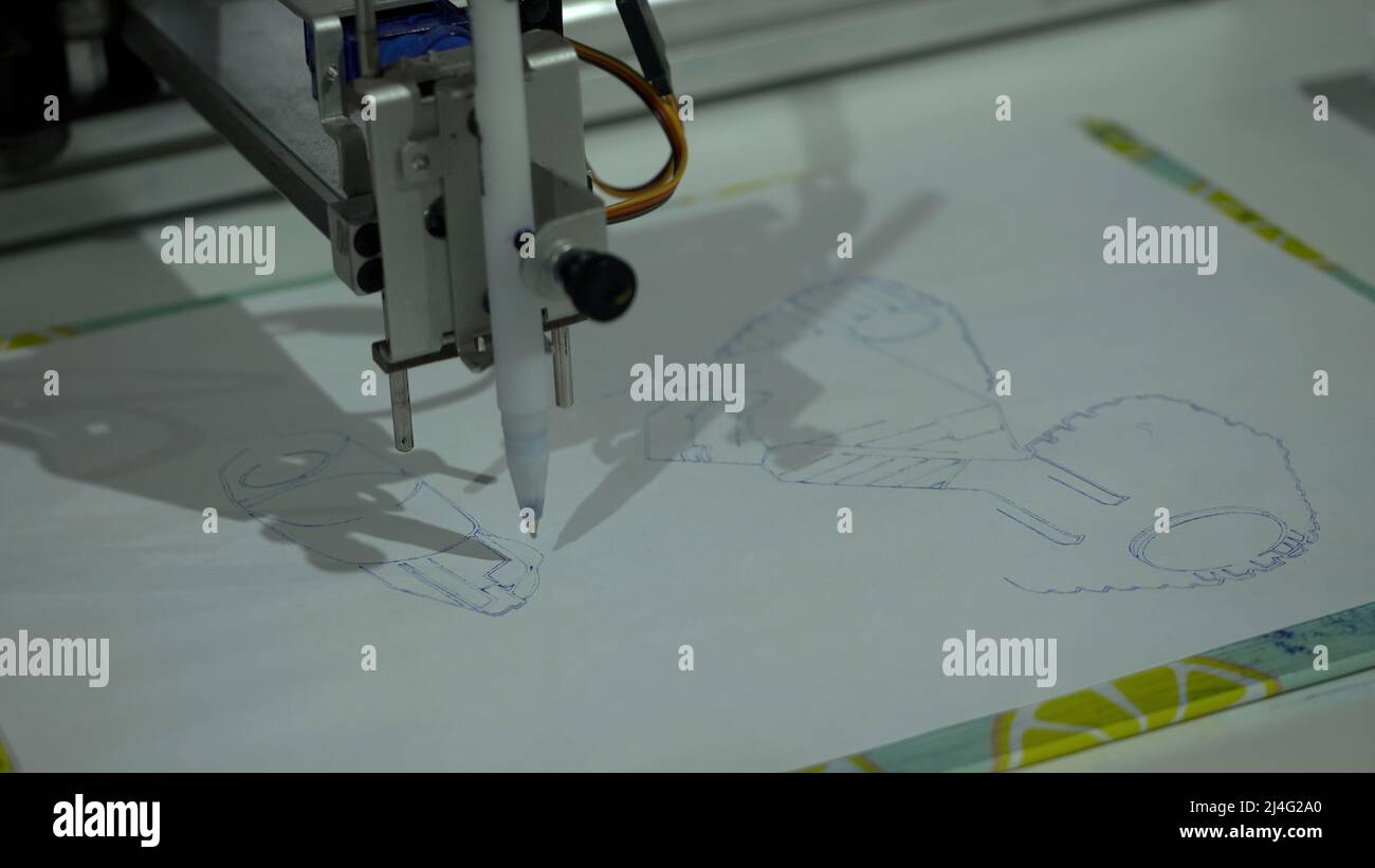 A machine that draws pictures and graphics. HDR. Robot machine that ...