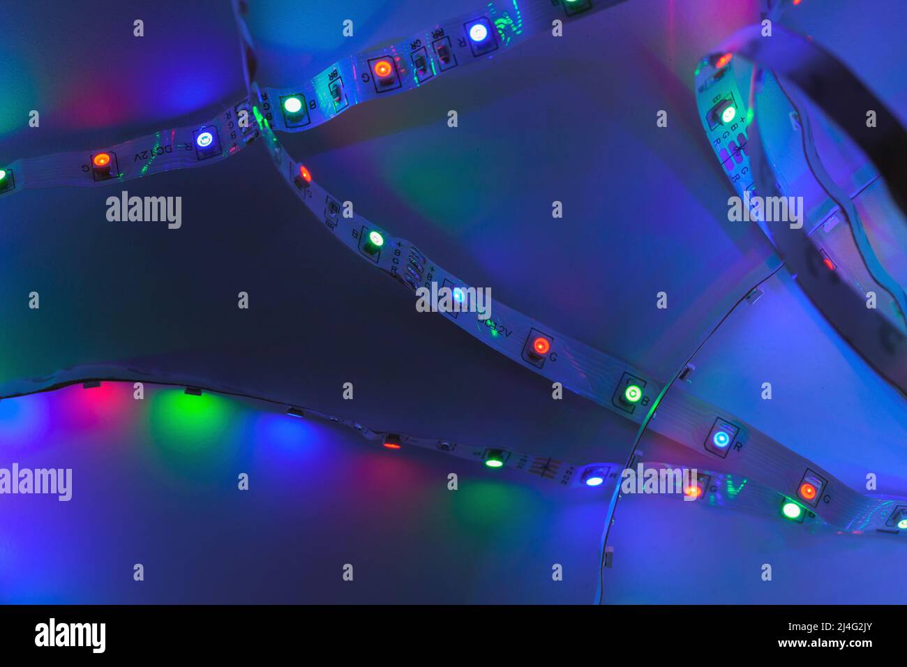 Glowing colorful LED strip lights, close up photo with selective soft ...