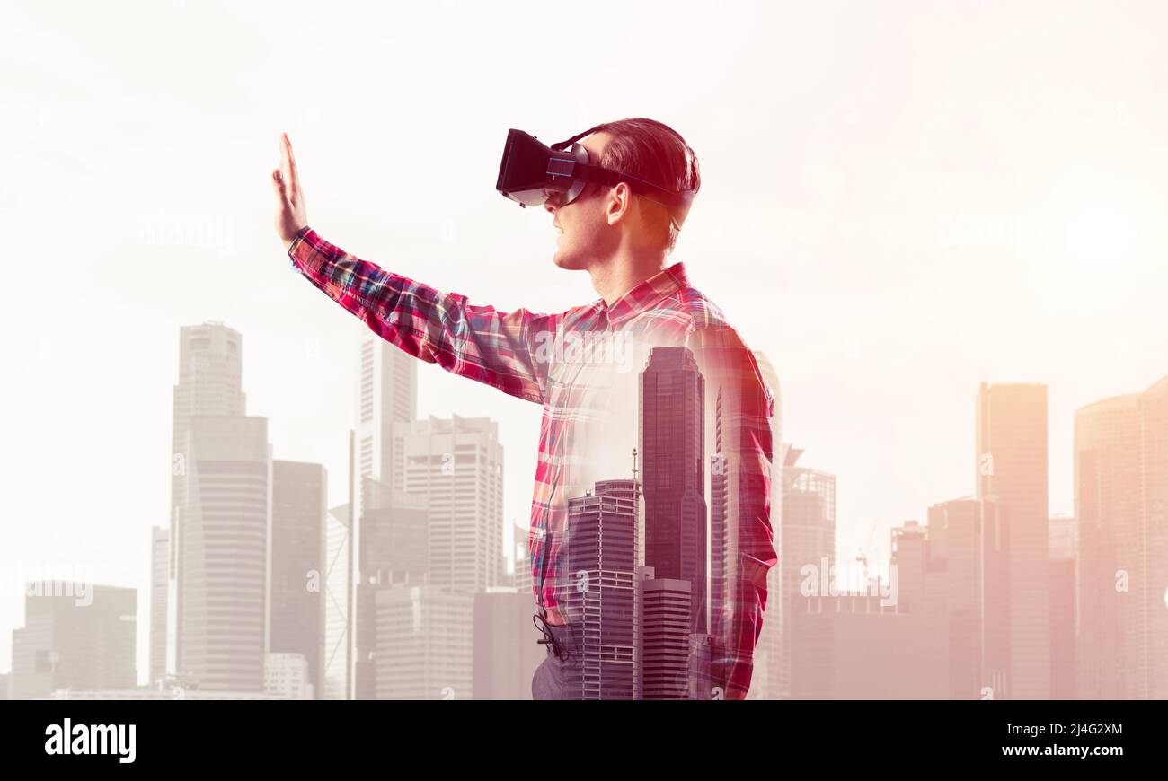 Guy wearing checked shirt and virtual mask stretching hand to touch ...