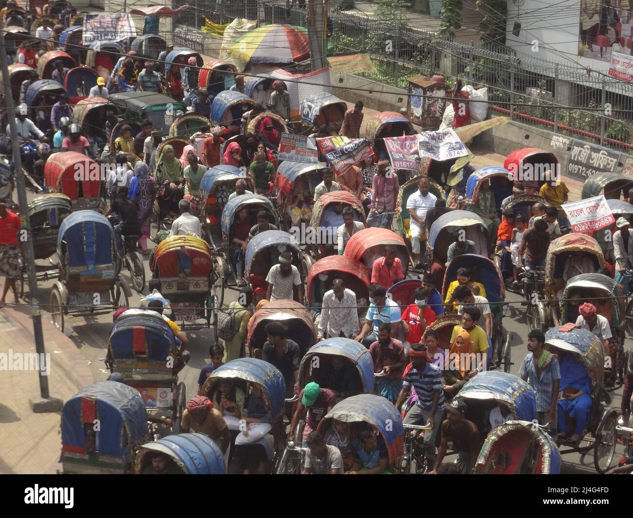 Dhaka, Bangladesh. 15th Apr, 2022. Rickshaw passengers are stuck in ...