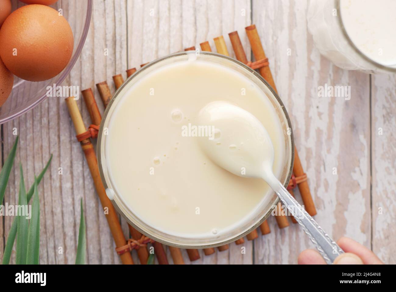 Condensed milk pouring in hi-res stock photography and images - Alamy