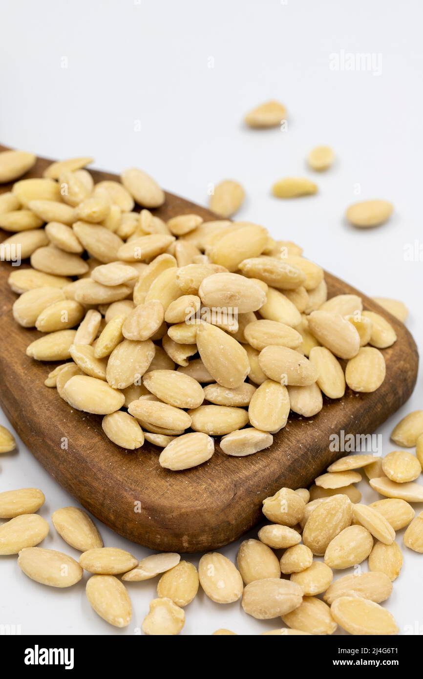 Peeled almond kernel isolated on white background. A bowl of almonds ...
