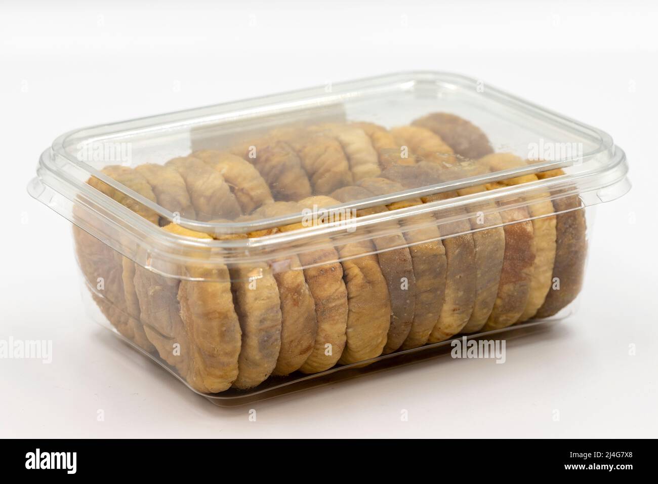 Packed dried figs on a white background. Packaged dried figs for sale ...