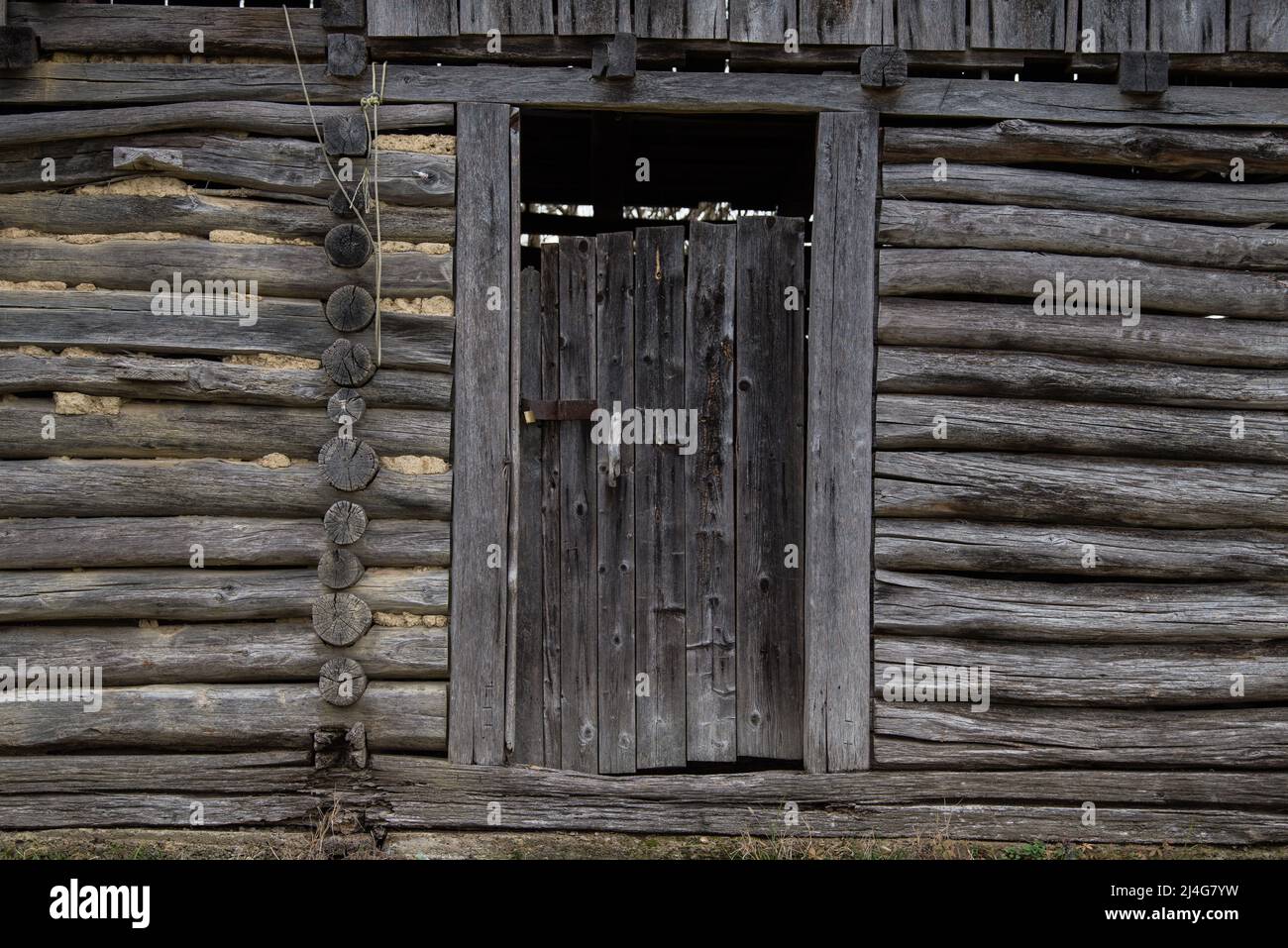 Old wooden rustic doors on rural home wall Stock Photo - Alamy