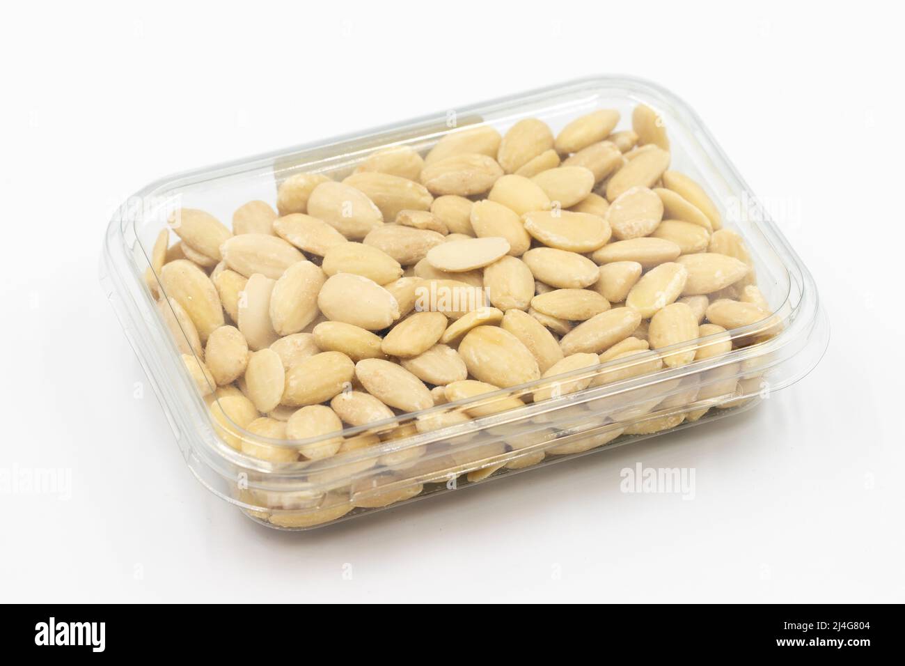 Packed peeled raw almonds on a white background. Peeled raw almonds ...