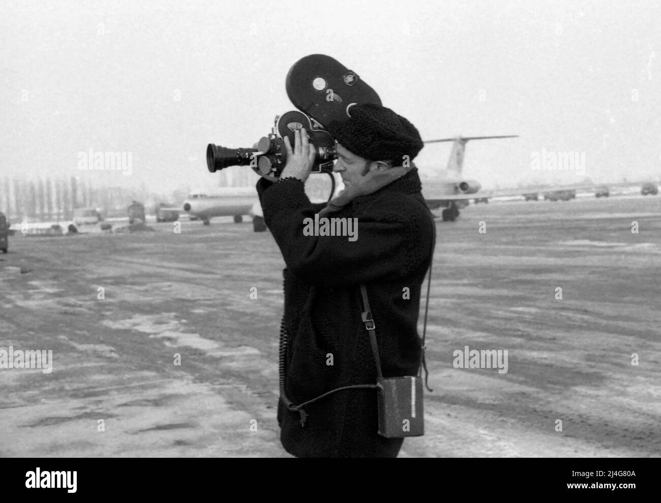 Romania, 1980. Cameraman for the Romanian television filming an event ...