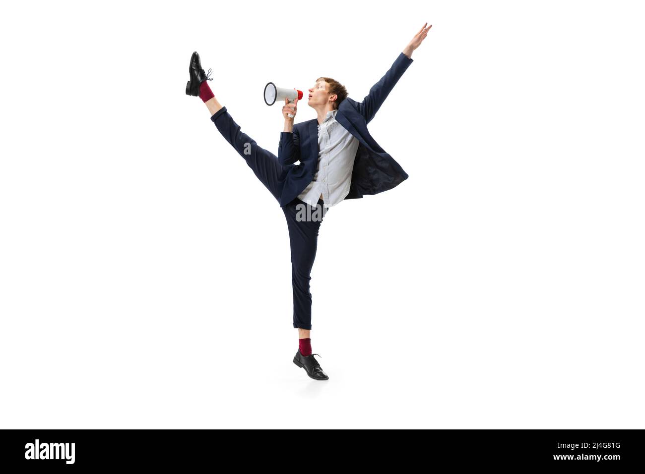 Man in office style clothes jumping and dancing isolated on white ...