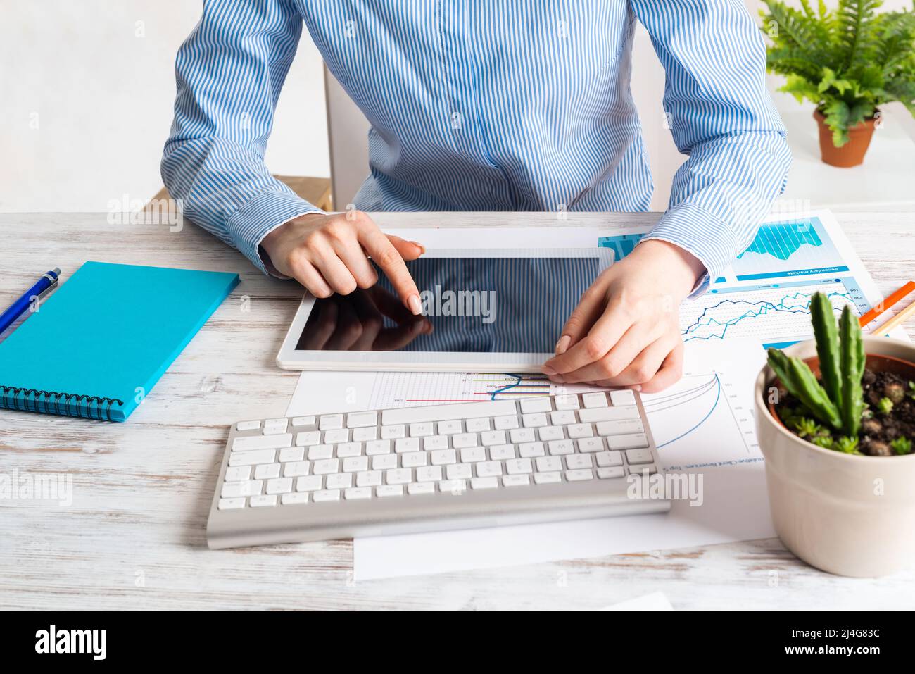 Manager using tablet computer with blank screen Stock Photo - Alamy
