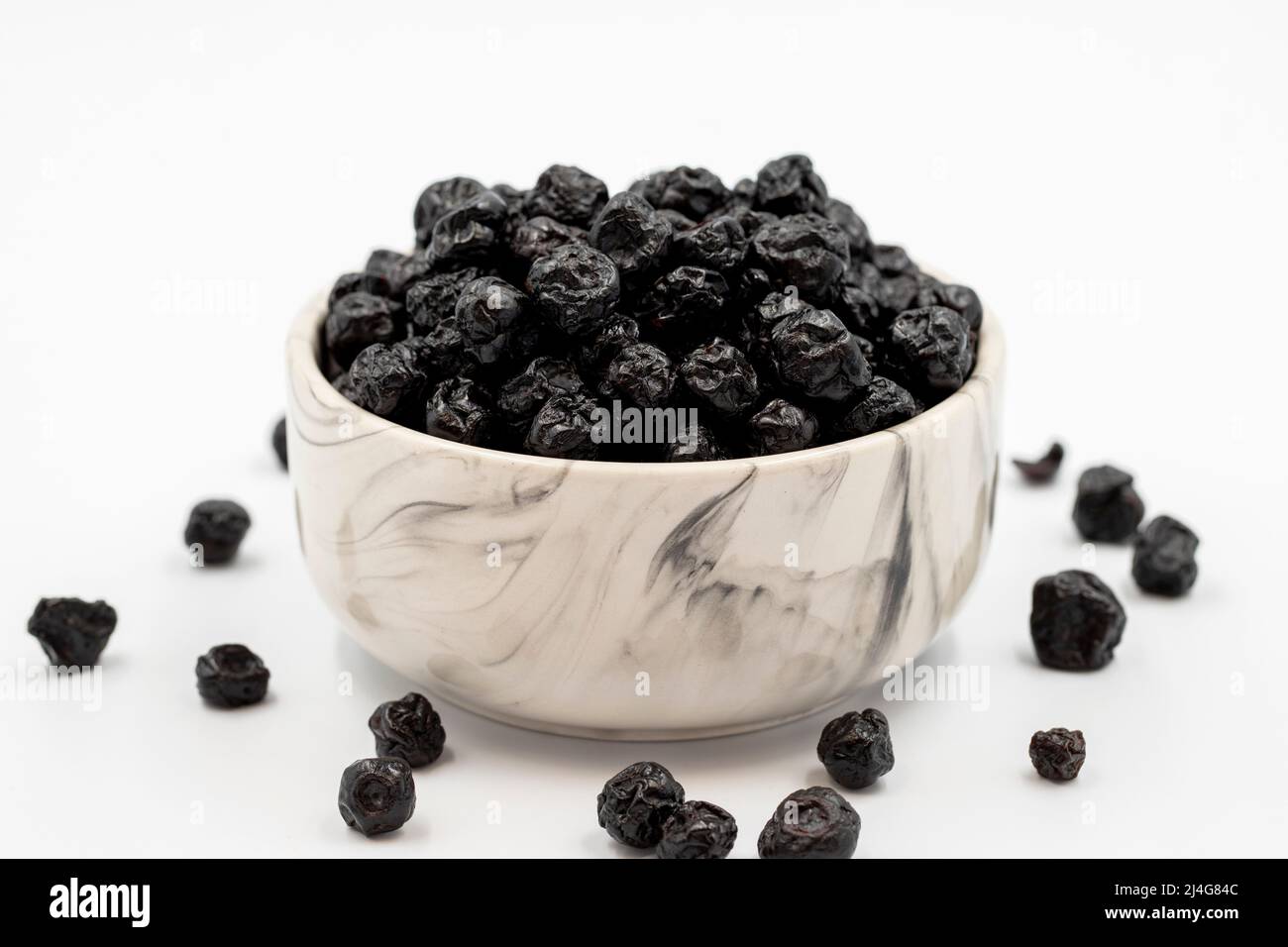 Dried blueberries isolated on a white background. Bulk blueberries ...