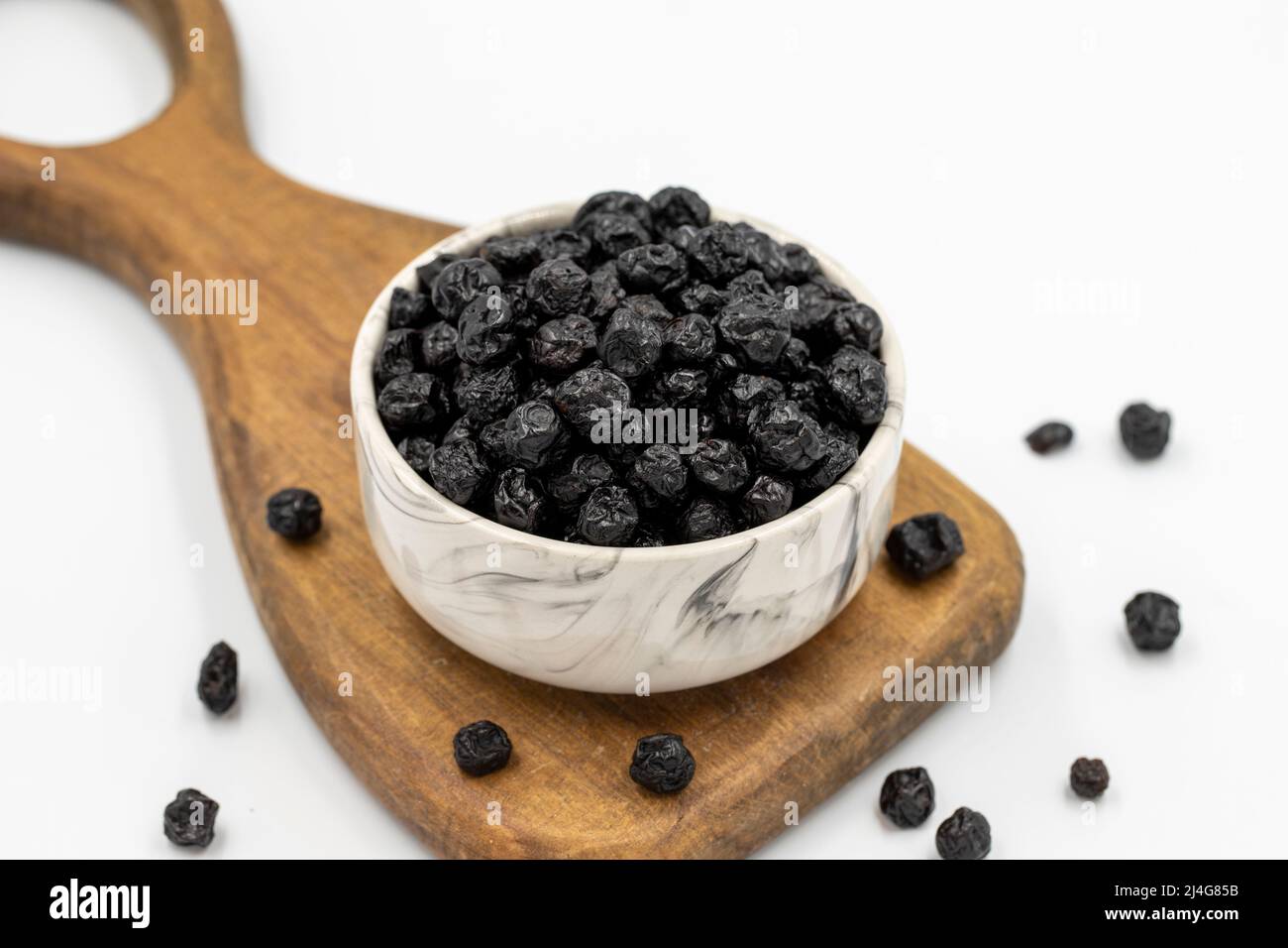 Dried blueberries isolated on a white background. Bulk blueberries ...