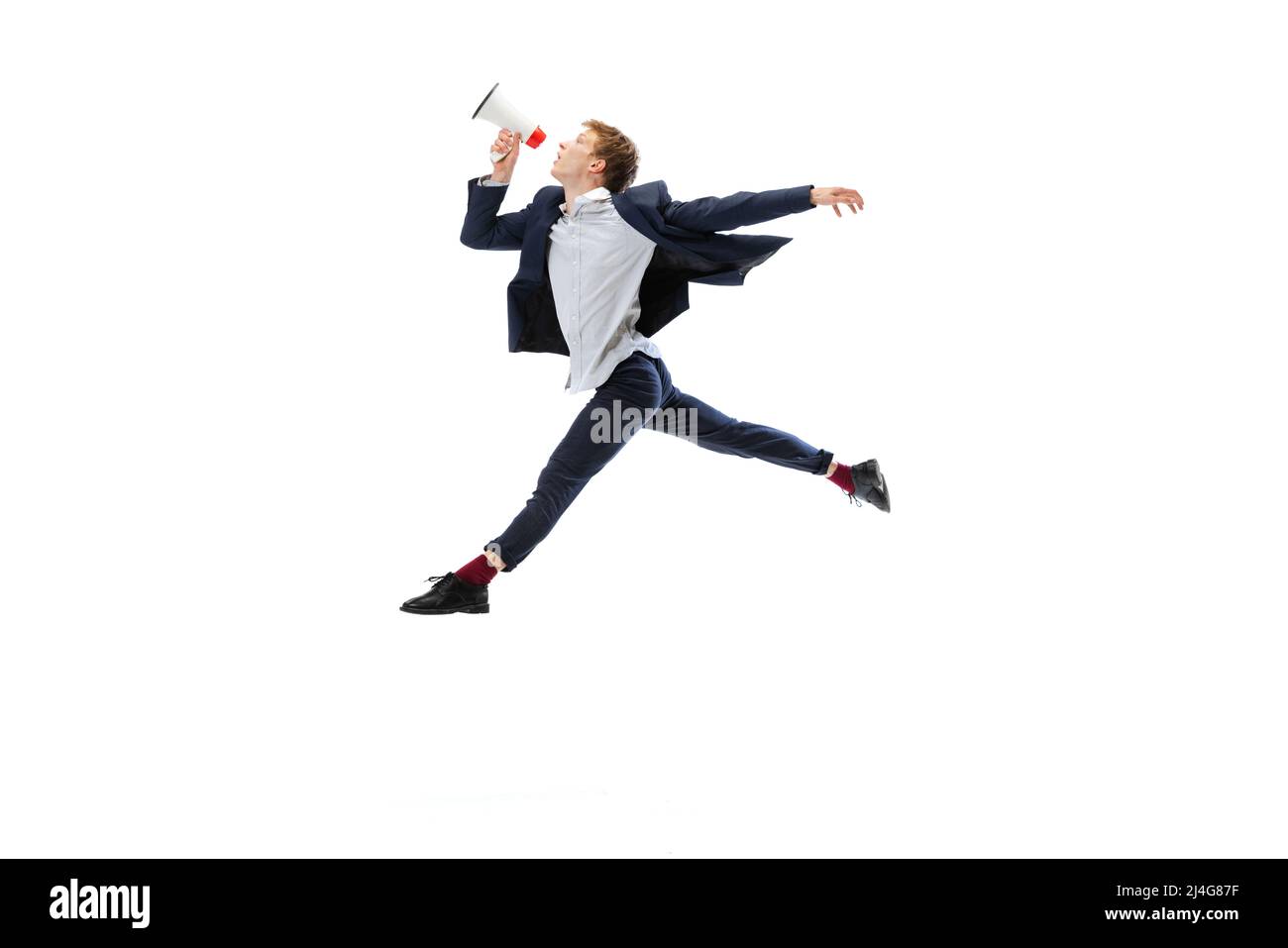 Man in office style clothes jumping and dancing isolated on white ...