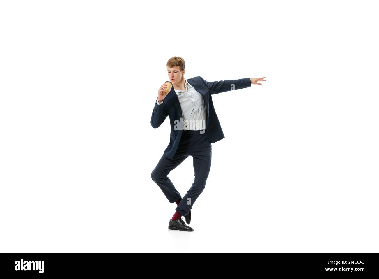 Man in office style clothes dancing with coffee to go isolated on white ...
