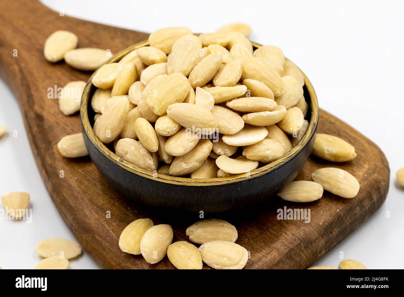 Peeled almond kernel isolated on white background. A bowl of almonds ...