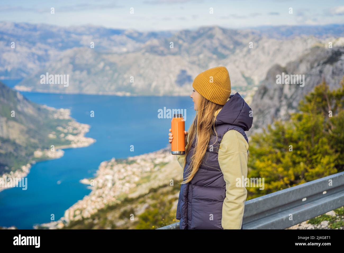 Woman tourist enjoys the view of Kotor. Montenegro. Bay of Kotor, Gulf ...