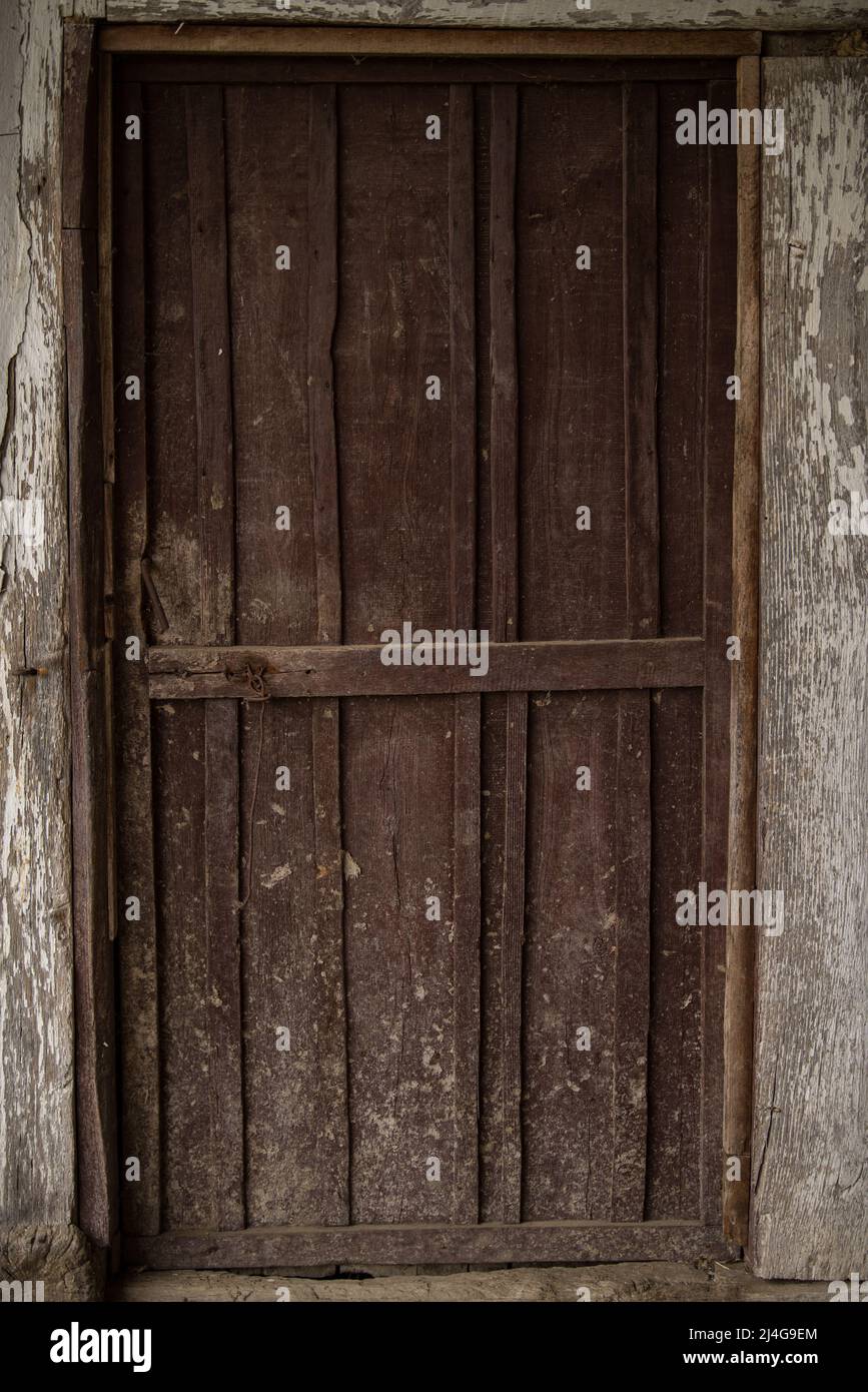 Old wooden rustic doors on rural home wall Stock Photo - Alamy
