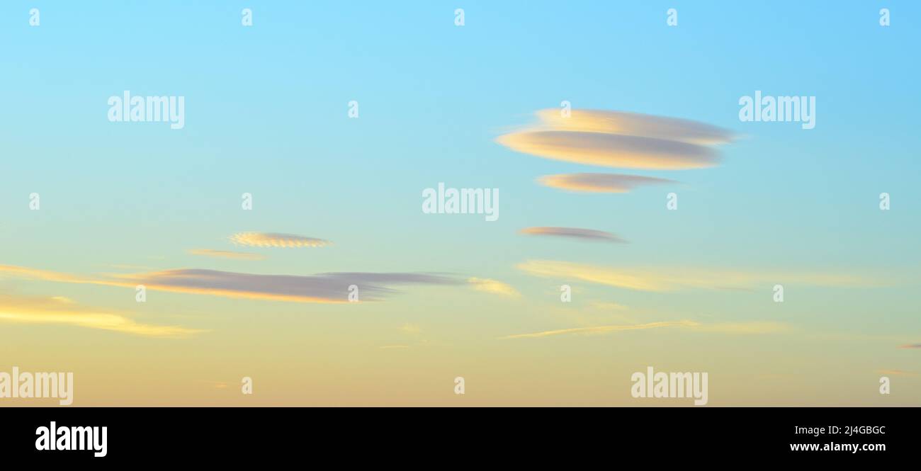 Lenticular clouds in the sky at dusk. banner Stock Photo - Alamy