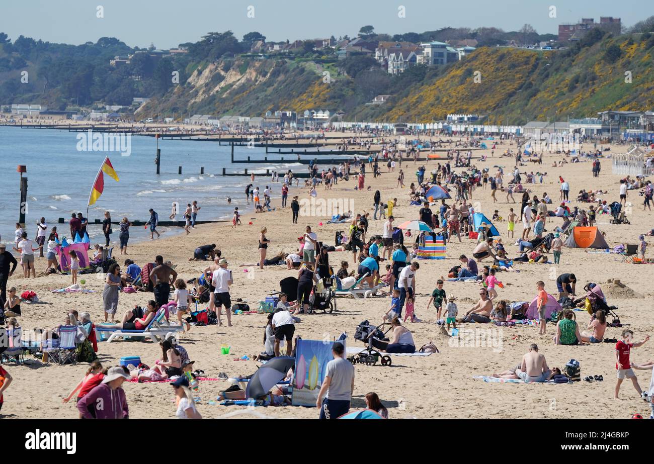 People enjoy the warm weather on Bournemouth beach. Good Friday is set ...