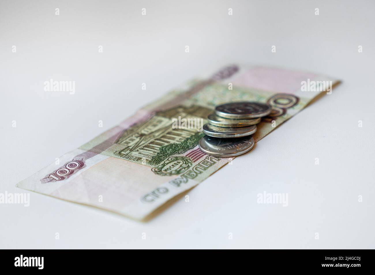 Russian rubles banknotes and coins on a white background Stock Photo ...