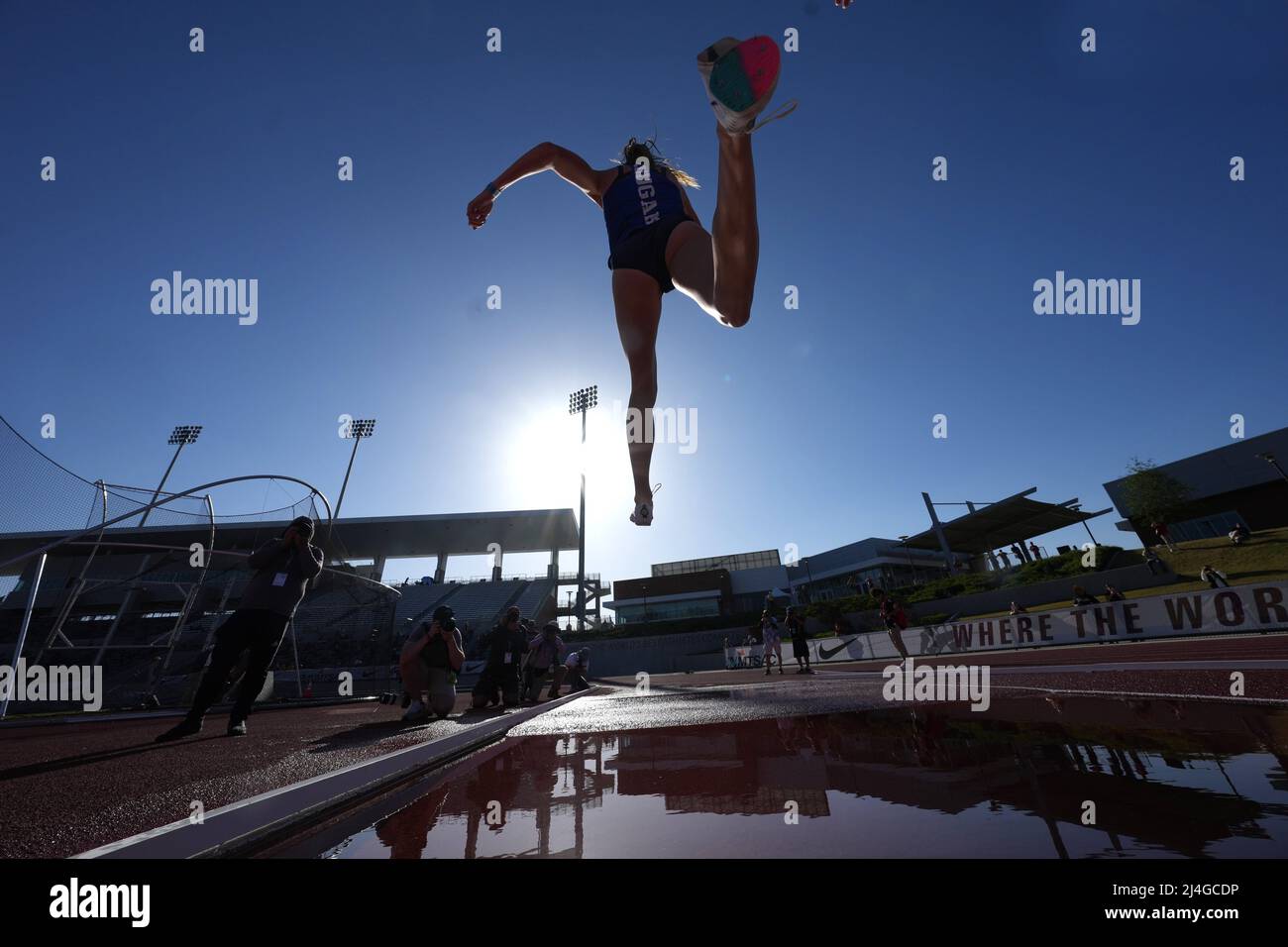 Elizabeth Dildine of BYU races over the water jump in the women's ...
