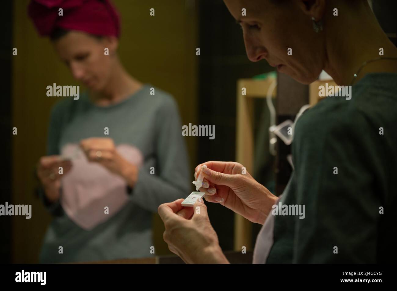 Young woman in a home quarantine testing for coronavirus presence in a ...