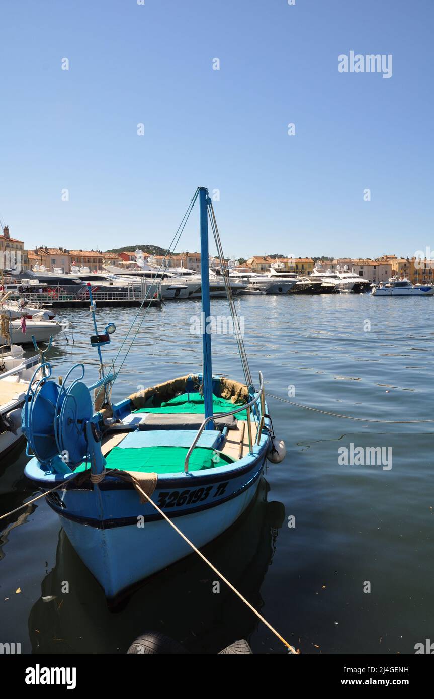 The luxury yachts of St Tropez with a traditional mediterranean boat in ...