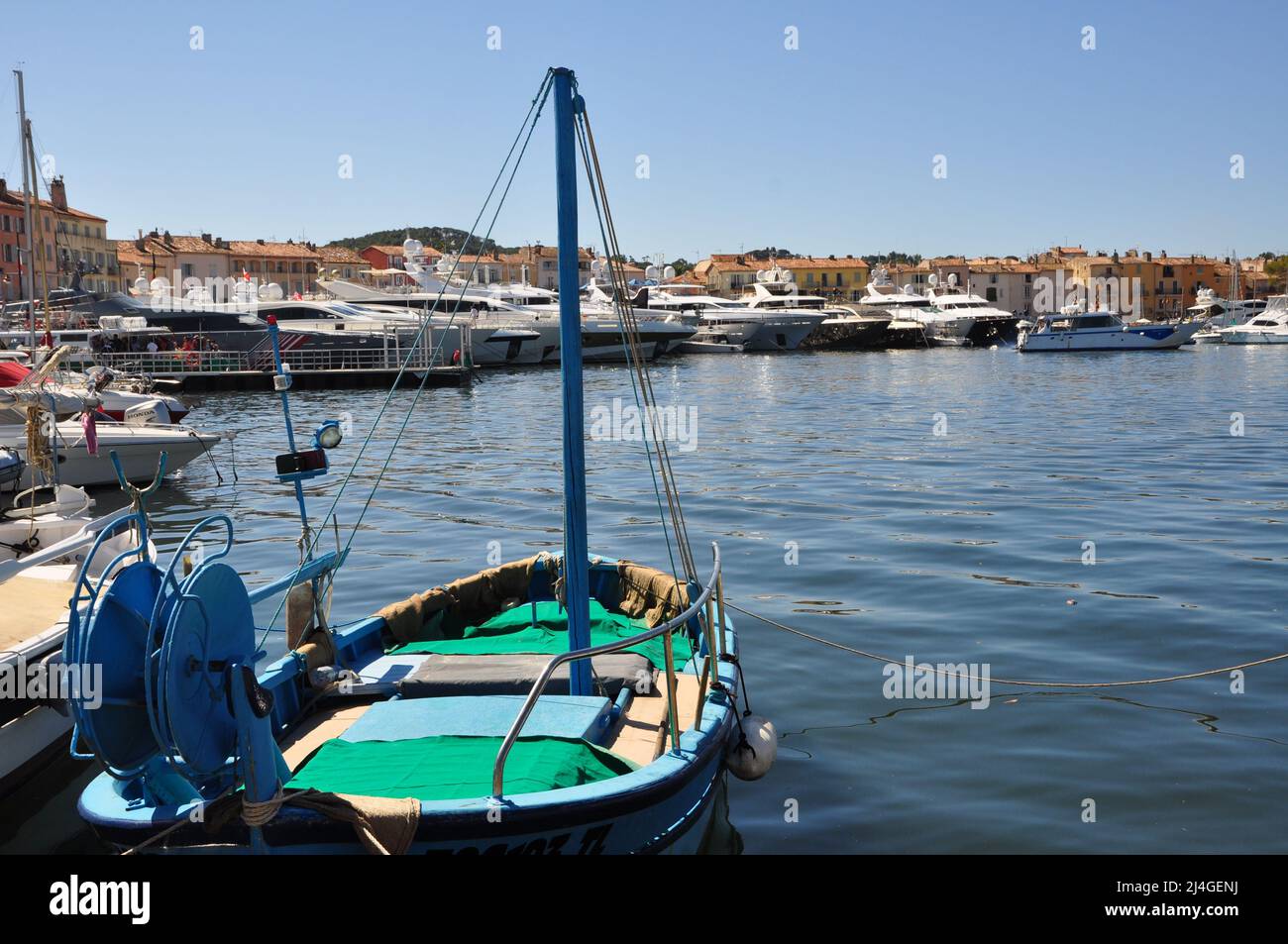 The luxury yachts of St Tropez with a traditional mediterranean boat in ...