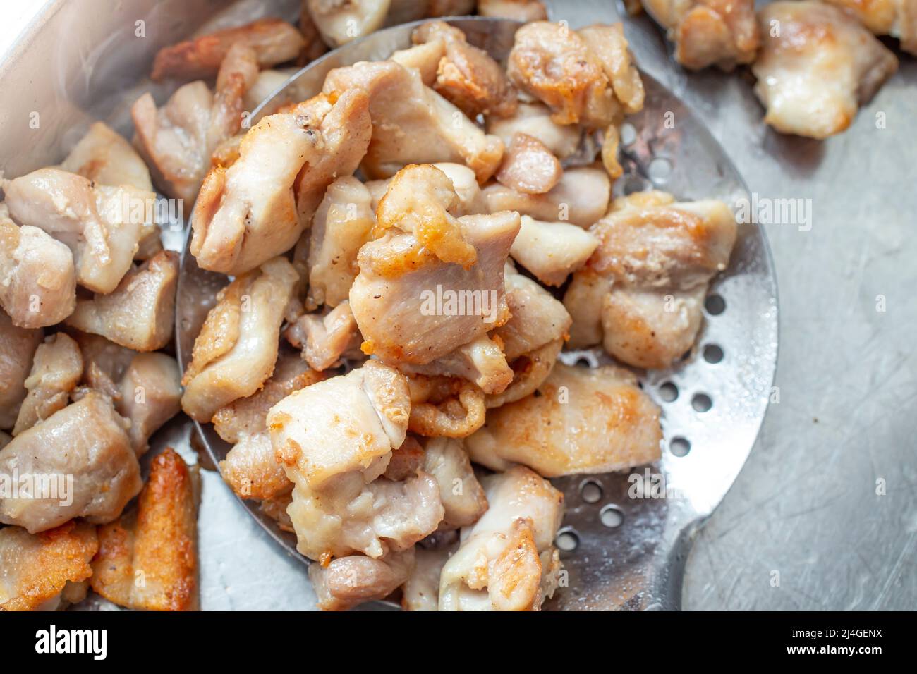 chicken meat chopped and fried in a stainless pan Stock Photo - Alamy