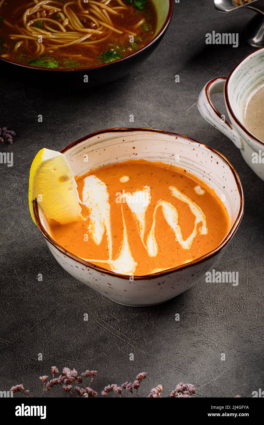 Red lentil cream soup with cream Stock Photo - Alamy